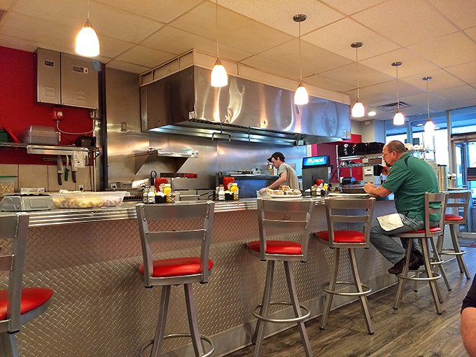 Counter seating&mdash;where breakfast becomes theater and you can watch your hash browns achieve that perfect crisp under skilled hands.