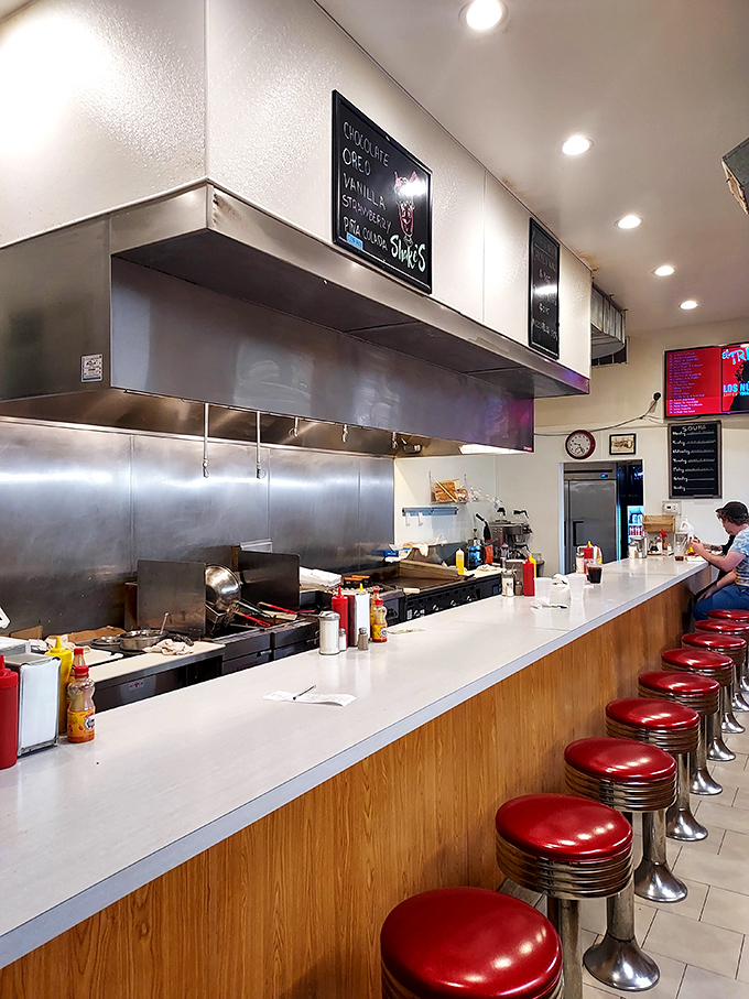 Red stools at the counter offer front-row seats to the sizzle and flip show&mdash;Chicago's most satisfying spectator sport.