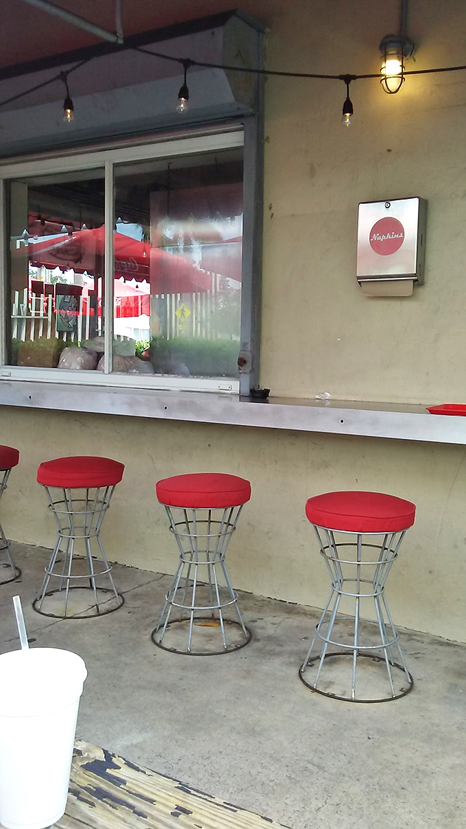 The ordering window&mdash;where dreams are shared and hot dogs are born. A humble portal to extraordinary flavor.