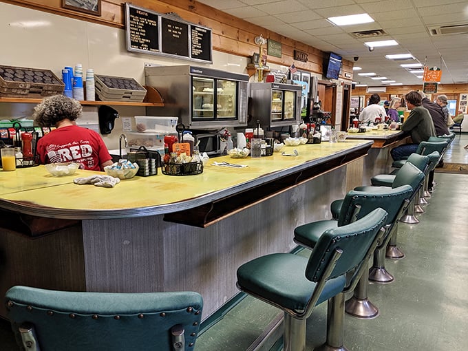 Counter seats offer front-row views of the kitchen choreography, where experienced cooks turn simple ingredients into memorable meals with practiced precision. 