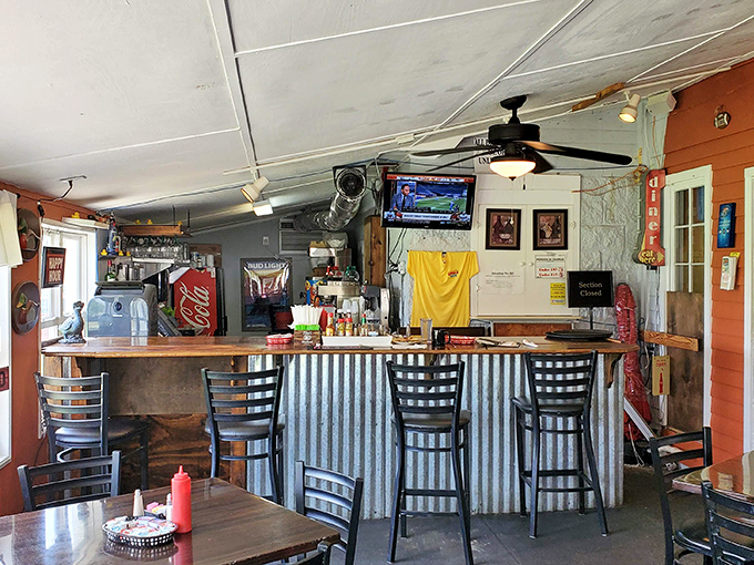 The counter seating area&mdash;where solo diners become temporary family and the coffee refills come with a side of local fishing reports.