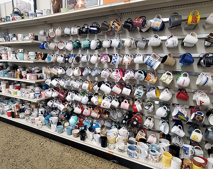 The mug wall&mdash;where coffee vessels with personalities ranging from "corporate retreat" to "quirky aunt" find new homes.