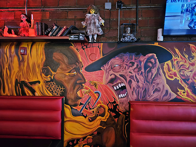 The booth where Freddy Krueger might take his mother for a nice birthday dinner. Terrifying artwork never looked so comfortable.