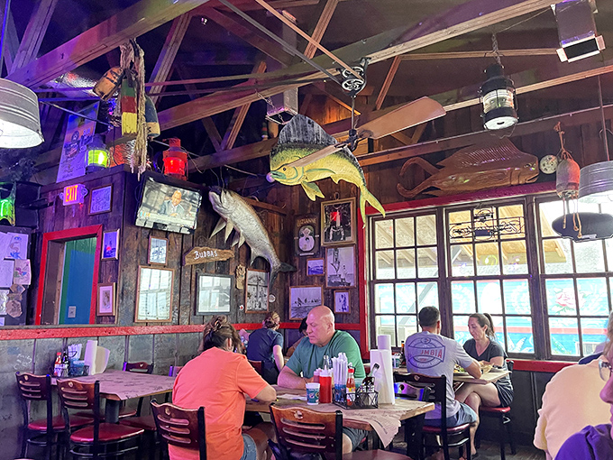 Where strangers become friends over shared love of seafood. The fish mounted on the wall serve as silent witnesses to countless happy meals.