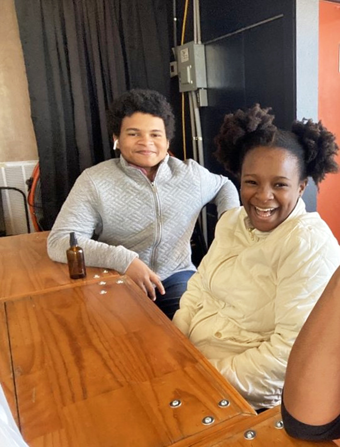 Happy faces around a handcrafted table prove great food creates the best moments, no fancy tablecloths or pretense required here.