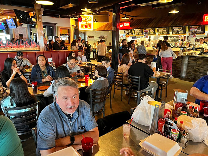 The dining room hums with the universal language of "mmm," where strangers become comrades united by sauce-smudged smiles.