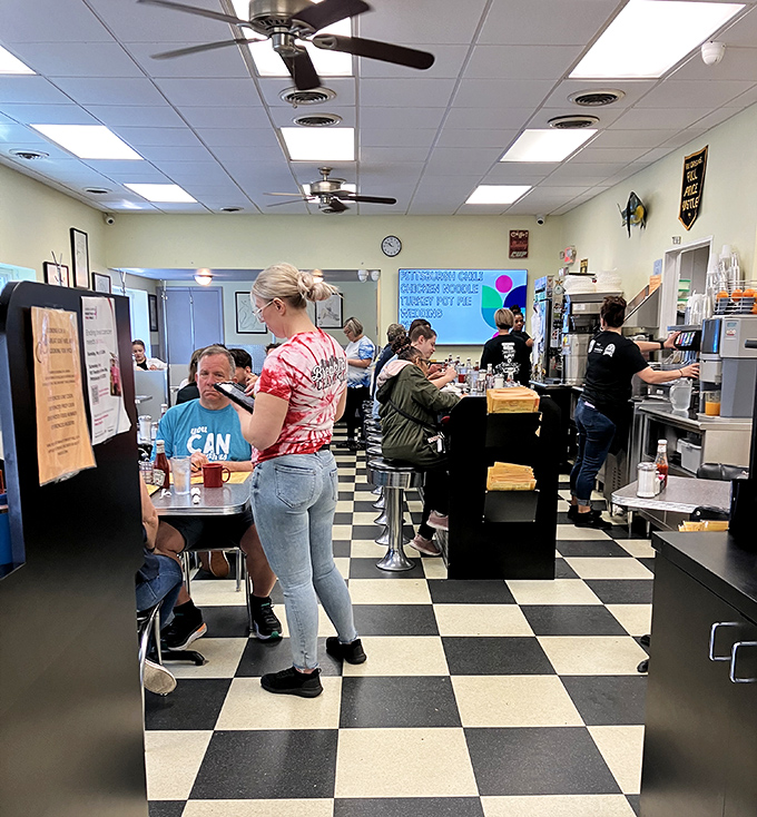 The bustling morning rush at Kelly O's – where waitresses navigate the checkered floor like chess masters and everyone leaves happy.