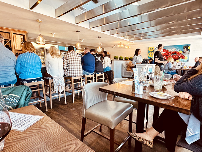 Happy diners perched at the bar, proving that the best seat in the house is wherever seafood is being served.