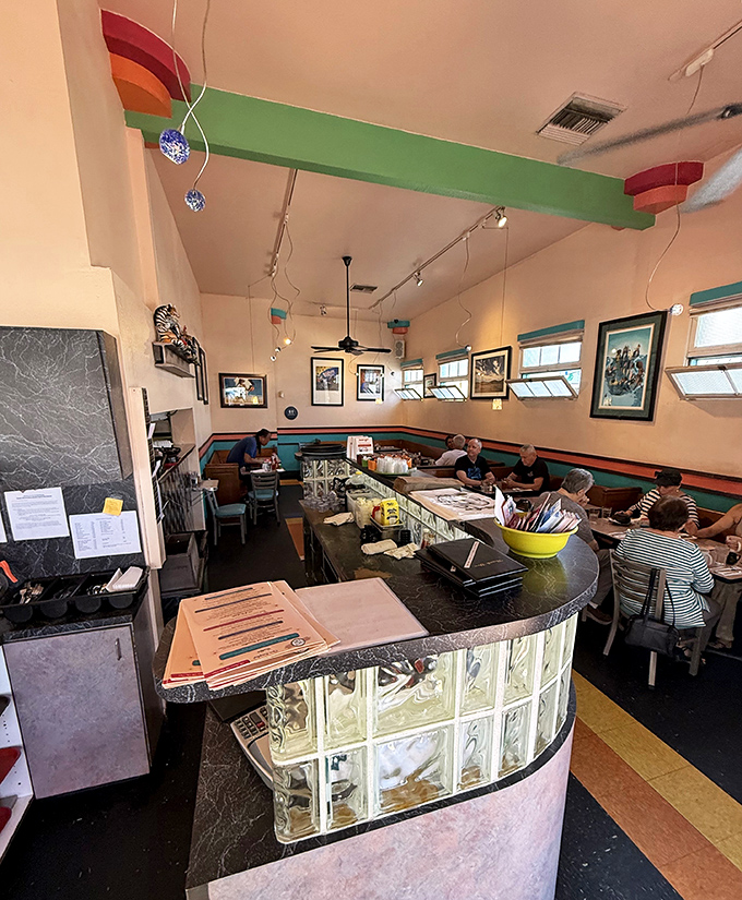 The curved counter creates a community. Strangers become temporary neighbors united by the universal language of good food.