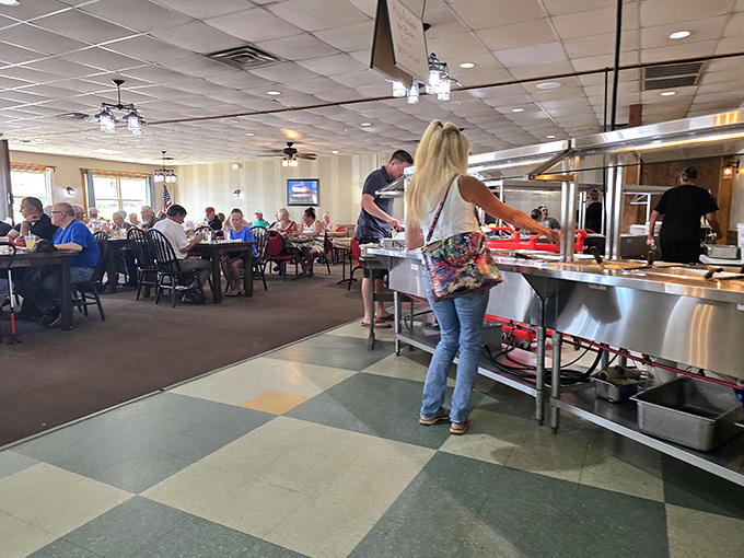 The buffet line: where dreams and stretchy pants come together. Notice how everyone maintains a respectful pace—this is serious business.