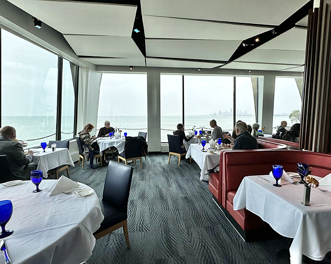 Dining with a view that makes conversation optional. Those blue goblets add a pop of color that matches Lake Erie on her best behavior.