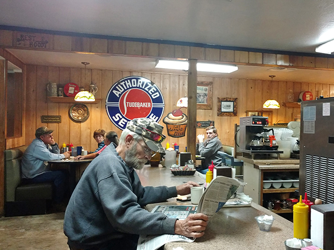 The morning regulars' club in session – where local news is exchanged over coffee and the newspaper still has a place at the breakfast table.