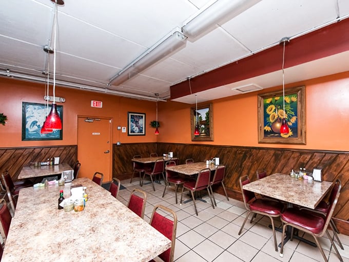 The dining room says, "We care more about your taste buds than your Instagram feed." Those speckled tables have hosted thousands of happy meals.