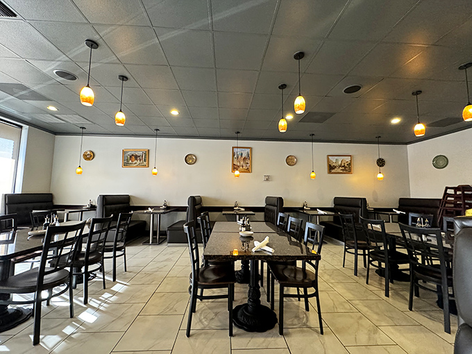 The dining room balances simplicity with subtle cultural touches. Those pendant lights cast a glow that makes everyone look like they're in a food commercial.