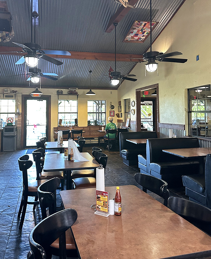 The dining room feels like the community's living room, where ceiling fans lazily spin stories of legendary meals shared among friends and strangers alike.