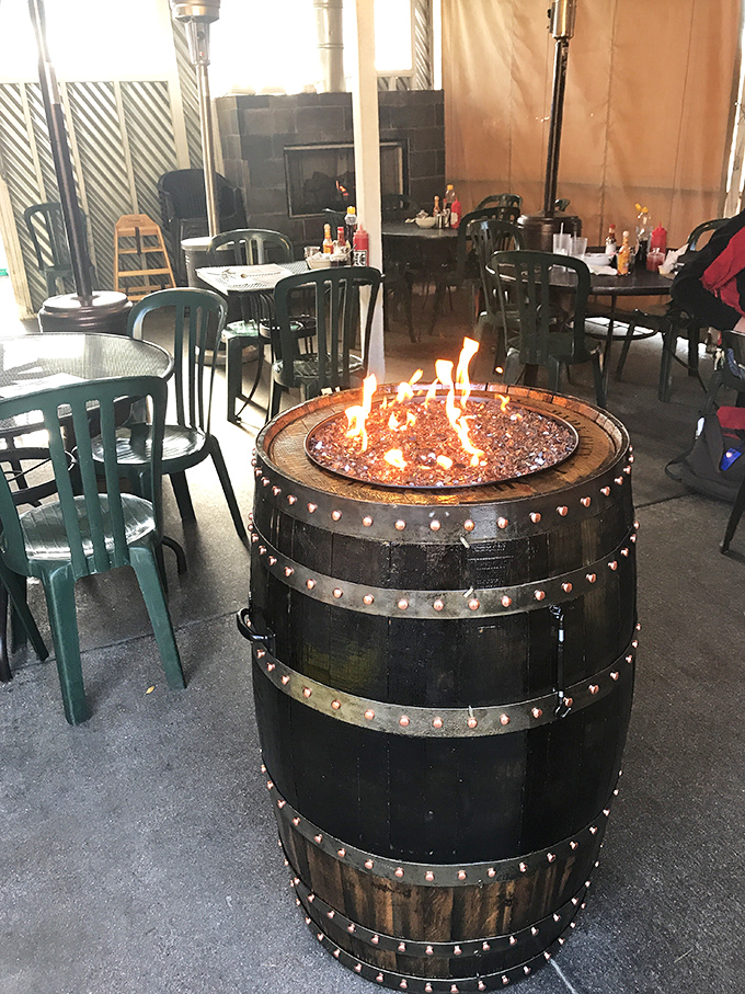 The outdoor dining area features a barrel fire pit&mdash;because the only thing better than breakfast is breakfast with a side of cozy ambiance.