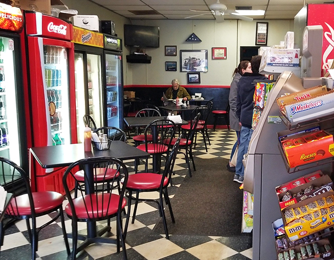 The dining area &ndash; where strangers become neighbors over coffee and conversation. Those red chairs have heard more local news than any newspaper reporter.