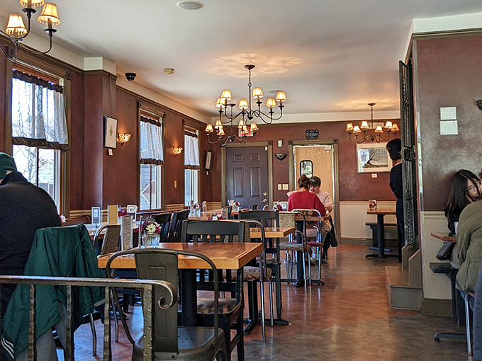 Warm wood tones, vintage chandeliers, and the gentle hum of conversation create the kind of atmosphere that makes you want to linger.