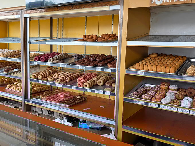 A donut display case that belongs in the Smithsonian. Each tray tells a story of Michigan mornings and midnight cravings.