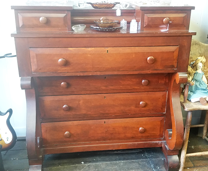 This Empire-style dresser with its curved front has more personality than most people you'll meet at a dinner party.