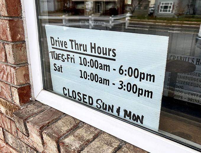 The window sign tells the story&mdash;this isn't a 24/7 operation because perfection requires rest, even for legendary burger joints.