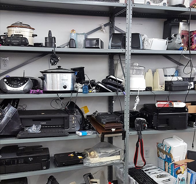 The electronics section&mdash;a time capsule of technological evolution where vintage cameras sit alongside DVD players in a "will it work?" lottery worth playing.