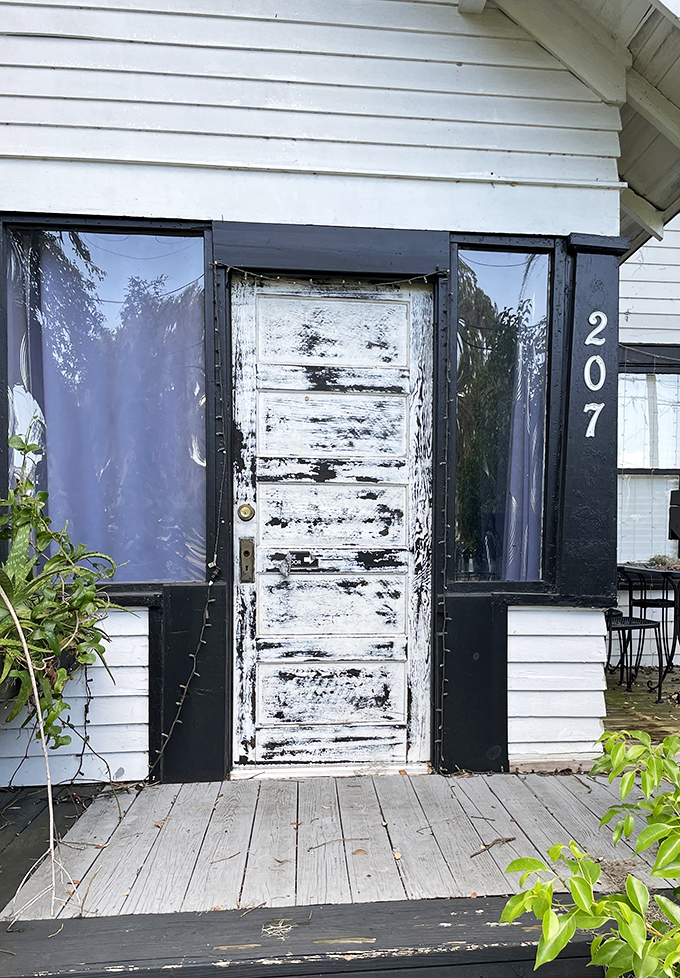 That weathered white door isn't just an entrance &ndash; it's a portal to one of Florida's most delicious hidden treasures.