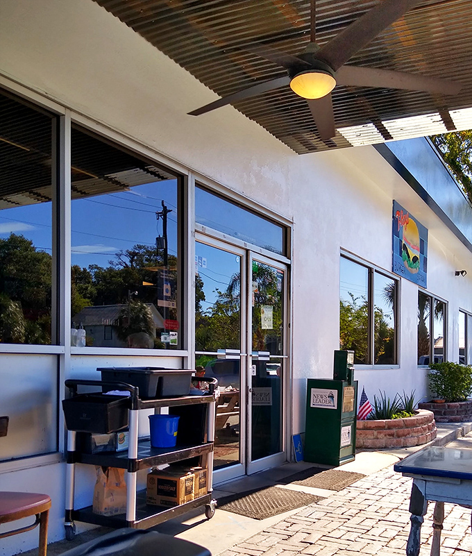 Florida sunshine streams through windows that have witnessed decades of satisfied smiles. Architecture that prioritizes function over fashion.