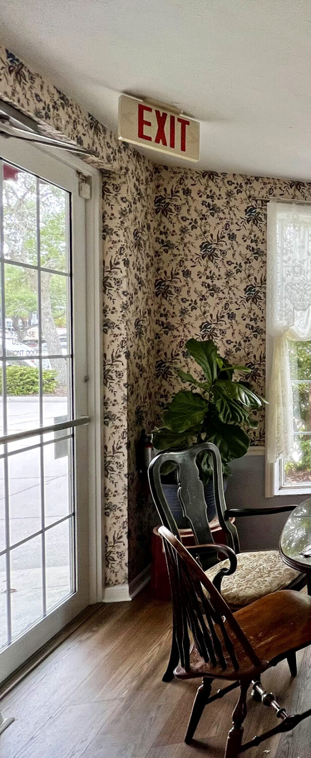 Even the exit at Millie's feels special&mdash;floral wallpaper, lace curtains, and a potted plant create a farewell as warm as the welcome.