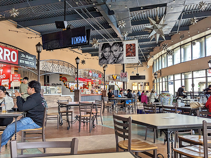 The food court's star-studded ceiling and New York pizza counter &ndash; because marathon shopping requires serious carb loading.