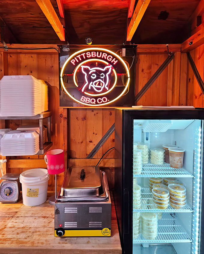 The neon pig sign glows like a beacon of barbecue hope against the rustic wooden interior&mdash;a shrine to smoked perfection.