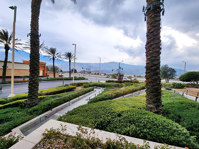 Meticulously maintained pathways and greenery frame mountain views, proving Desert Hills knows shopping is as much about the experience as the bargains.