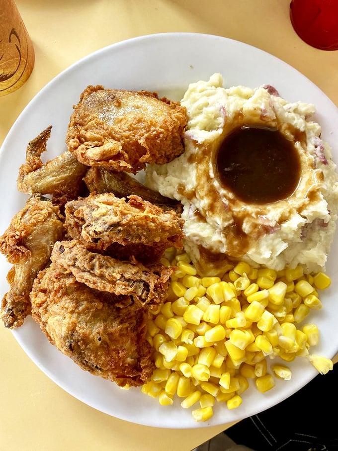 Fried chicken that's dressed for dinner with mashed potatoes, gravy, and corn&mdash;a plate that whispers "nap time" in your ear.