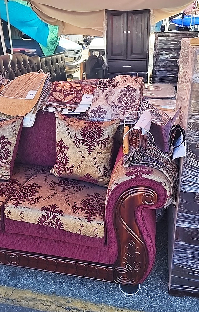 Furniture that asks, "Why pay retail?" This ornate burgundy beauty awaits someone who appreciates baroque style without the baroque price tag.