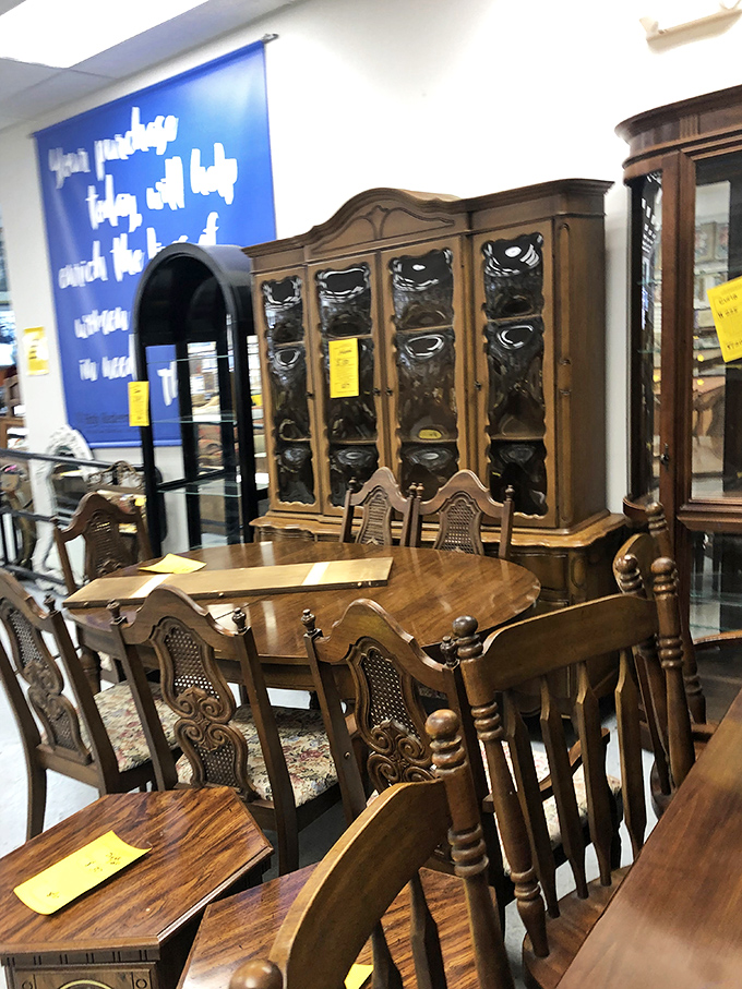 Dining elegance awaits with this ornate table set and matching china cabinet. Thanksgiving dinner just found its new headquarters.