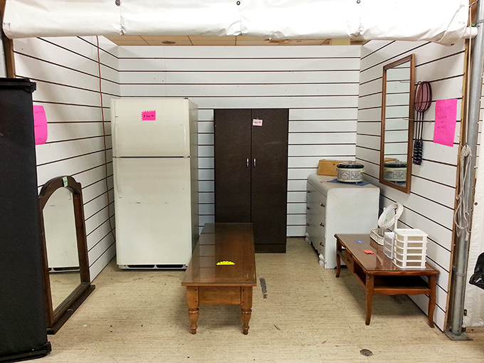 A perfectly staged furniture display that feels like walking through someone's abandoned living room&mdash;complete with that refrigerator your grandparents had.
