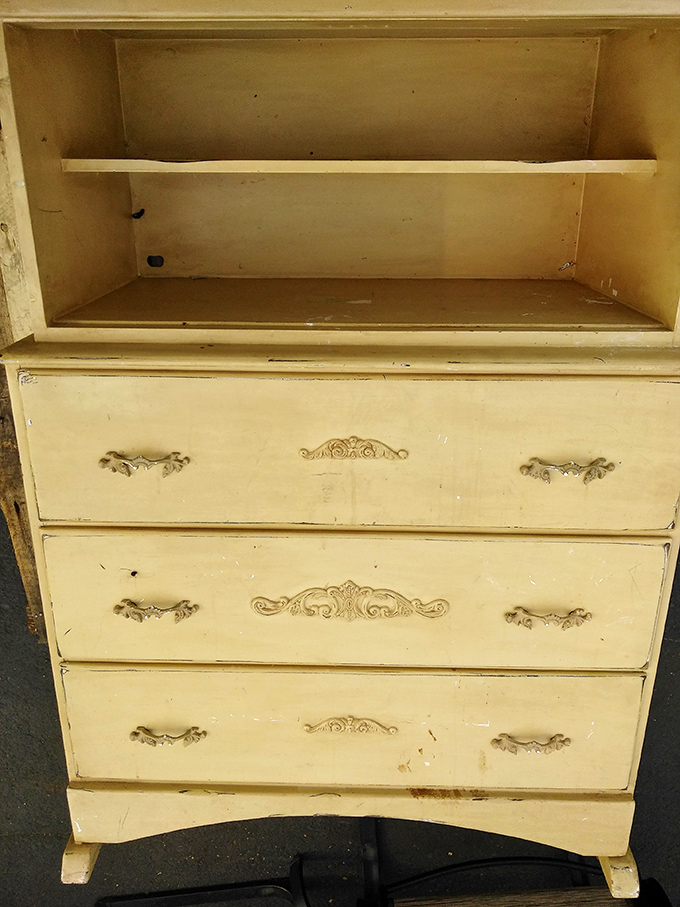 This cream-colored dresser with ornate hardware is just waiting for a DIY enthusiast with vision and sandpaper.