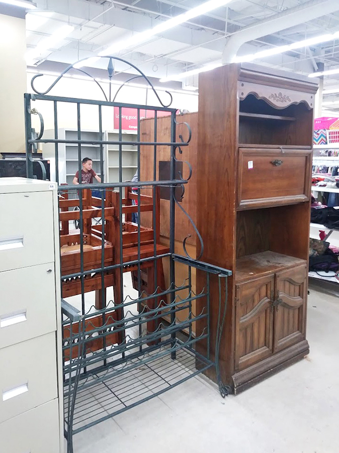 Wine racks and cabinets huddle together, dreaming of their next home where they'll finally get that refinishing project.