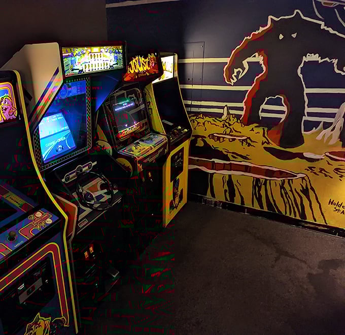 The arcade corner offers nostalgic entertainment while you wait for your pizza&mdash;Pac-Man never tasted anticipation this delicious.