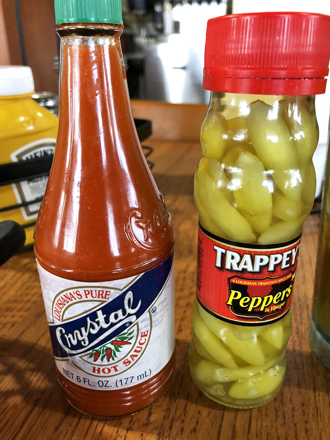 The condiment duo that elevates everything – Crystal hot sauce and pickled peppers standing by for flavor duty.