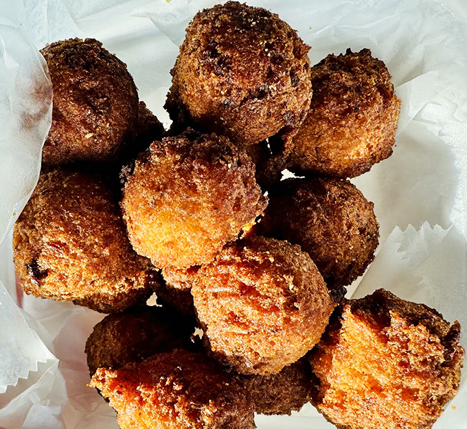 Hush puppies golden enough to make the sun jealous. These cornmeal delights are the supporting actors that steal every scene.