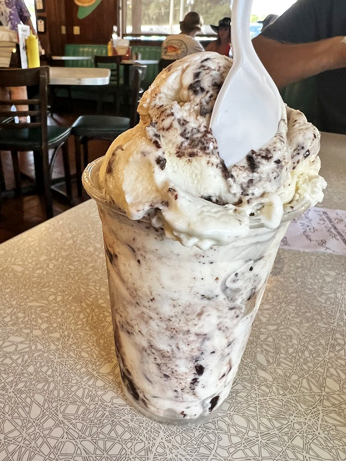 This cookies and cream milkshake isn't just dessert&mdash;it's a cup of happiness with a spoon standing at attention, ready for duty.