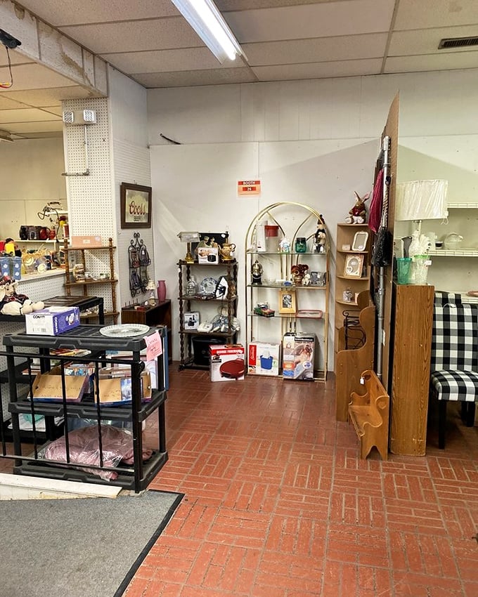 Red brick floors lead the eye through a carefully curated chaos of shelving units, where vintage meets practical in the best possible way.