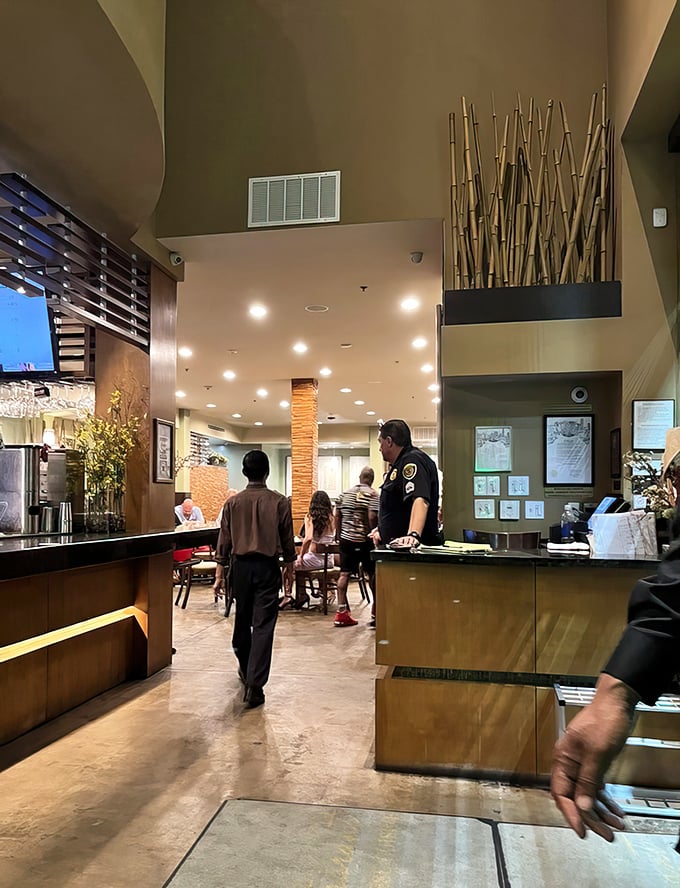 The waiting area with its serene bamboo forest mural hints at the authentic flavors awaiting beyond the host stand.