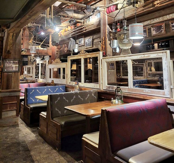 Booth seating that feels like you've discovered a secret dining nook in an old fishing lodge. Those hanging lamps? Pure rustic genius.