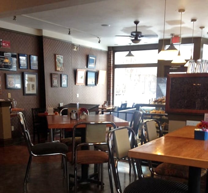 Vintage chandeliers and comfortable seating create an atmosphere where strangers become friends over shared plates of incredible food.