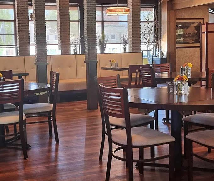 The dining room's warm wood floors and cream-colored banquettes create an atmosphere where you'll want to linger long after dessert.