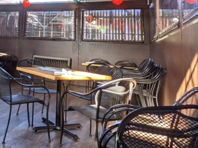 The patio seating area feels like a secret garden where breakfast tastes better and coffee stays mysteriously warm until the last sip.