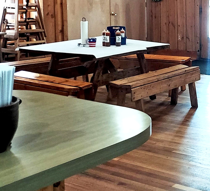 Wooden picnic tables that have witnessed countless barbecue epiphanies and the silent nods of approval that replace conversation when the food arrives.