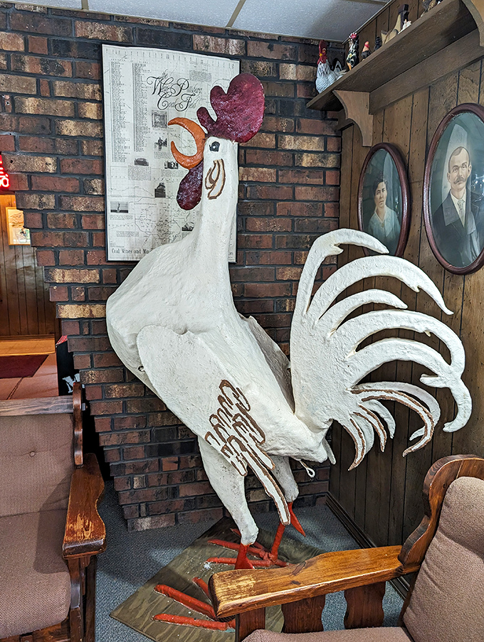 The rooster stands guard inside, a whimsical sentinel ensuring every piece of chicken meets the exacting standards that built this legend.